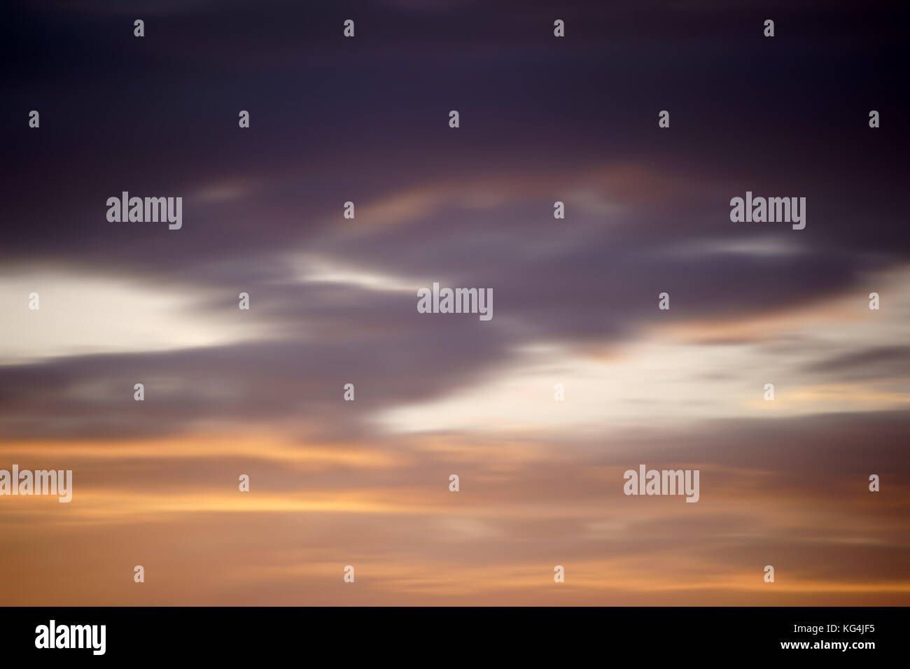 A blurred sky in the evening with colorful clouds Stock Photo - Alamy