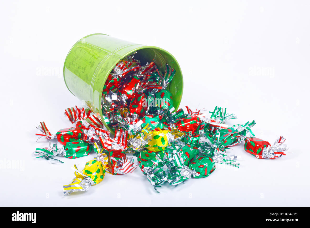 Colorful candy and green bucket on white background Stock Photo - Alamy