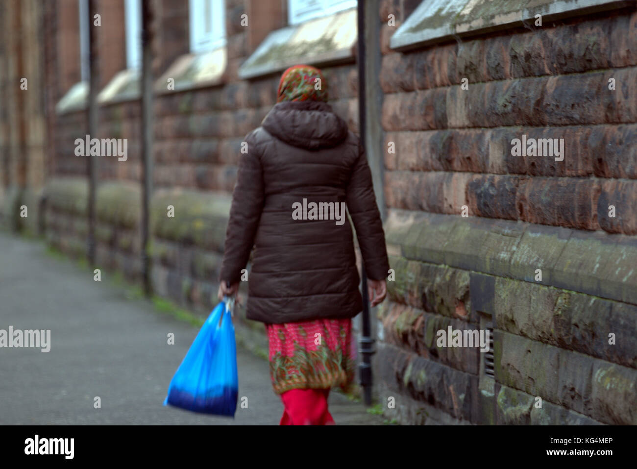 Asian family refugee dressed Hijab scarf on street in the UK muslim ...