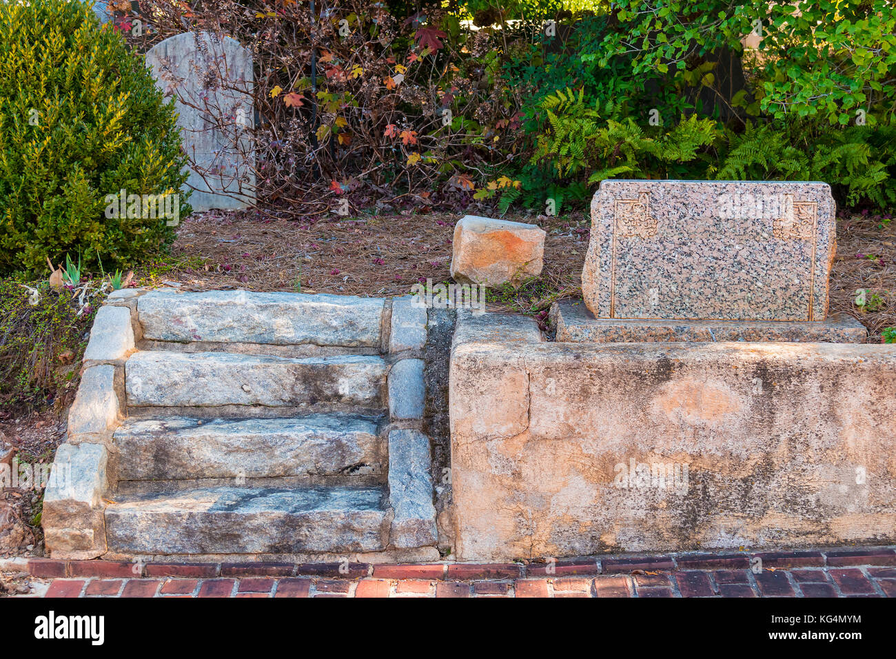 The small tombstone and stairs closeup in shadow on the Oakland ...