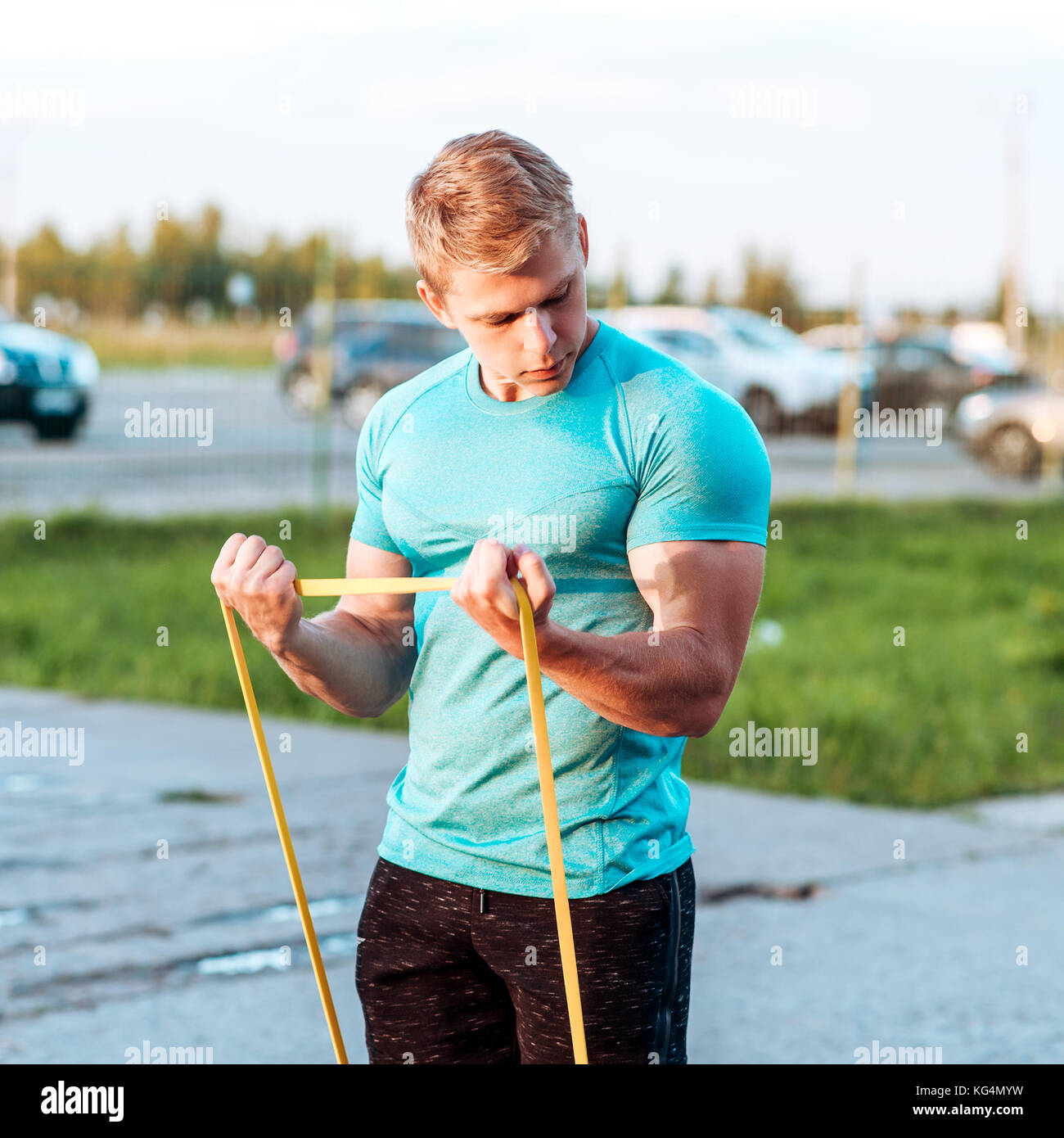 A man is training his hands on rubber loops. Healthy lifestyle of ...