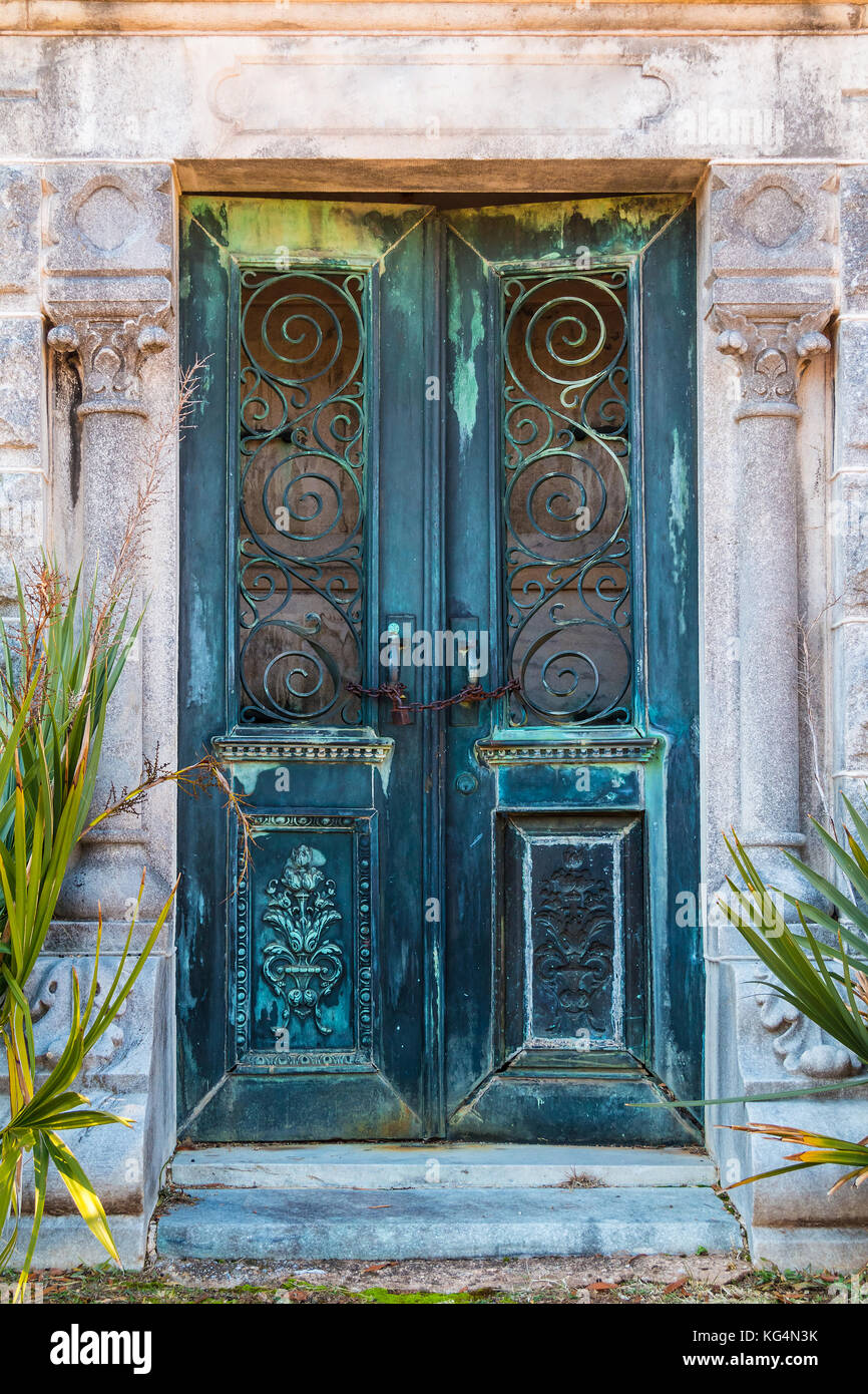 The wooden door of the stone crypt closeup front view Stock Photo - Alamy