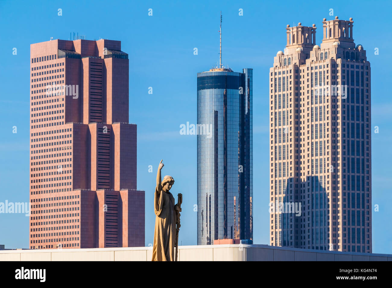 The sculpture of Virgin Mary on the Oakland Cemetery on the background ...
