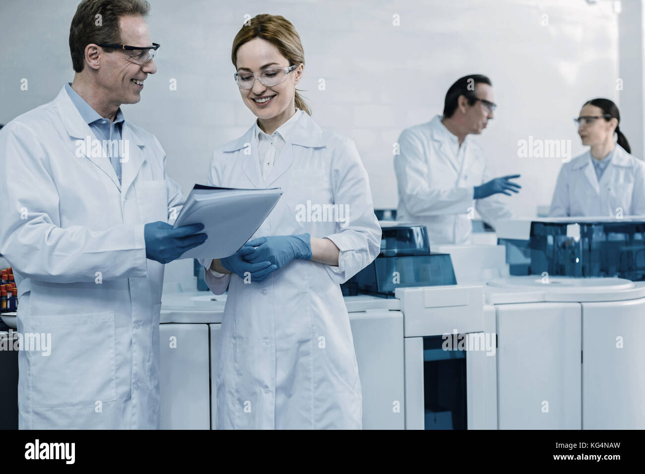 Joyful smart scientist working together Stock Photo - Alamy