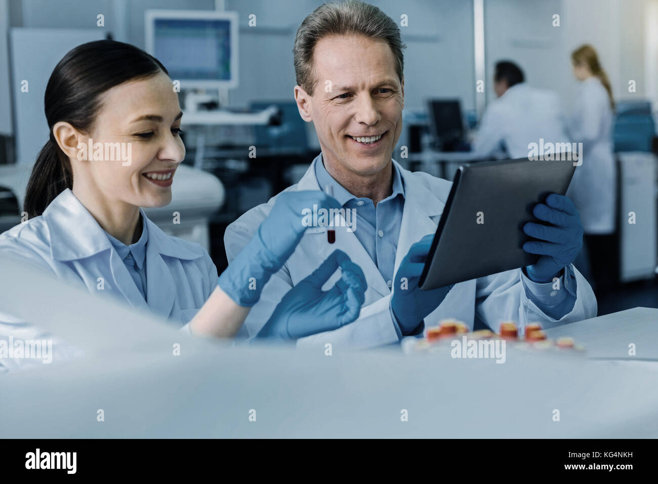 Happy research man tablet hi-res stock photography and images - Alamy