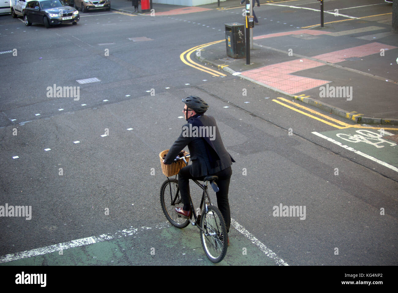 male man cyclist on bike at traffic lights head of traffic viewed from ...