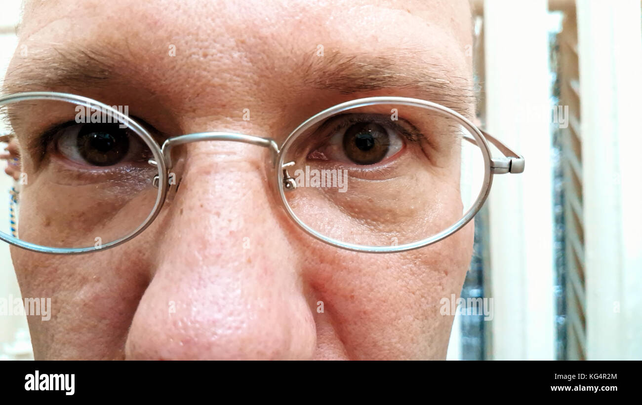 Face of a man wearing glasses Stock Photo - Alamy