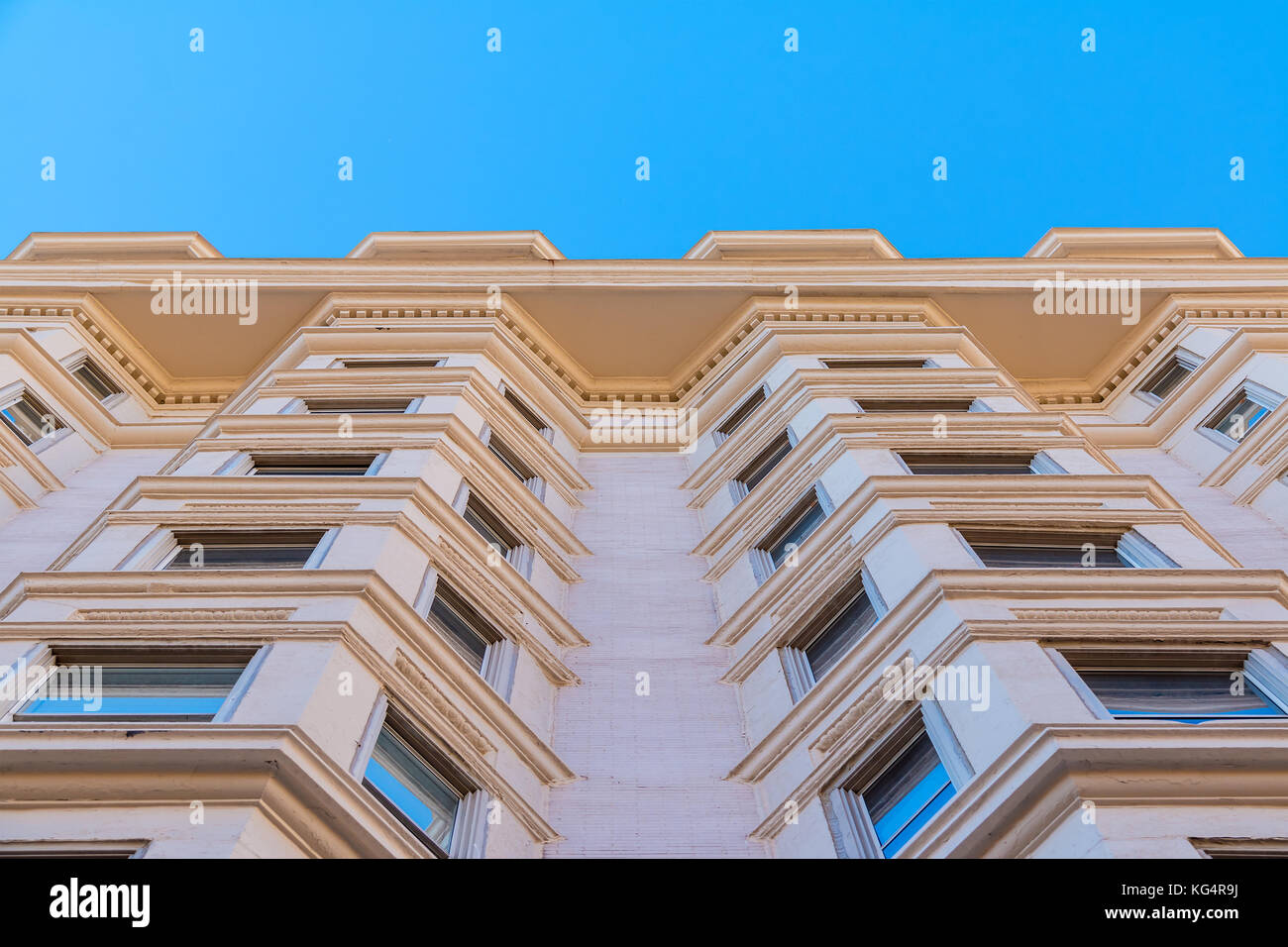 Bottom view of the facade of the office building on the background of ...