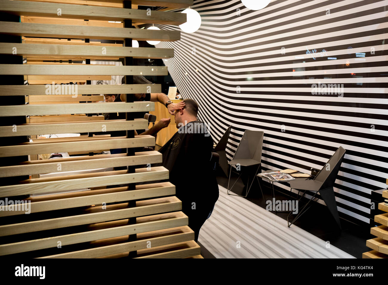 A City worker has a haircut and endures Turkish hair singeing in Adams ...