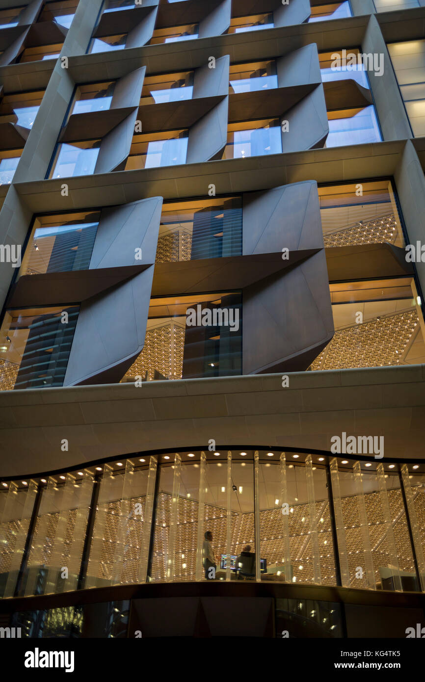 An employee with Bloomberg works beneath bold, modern architecture by ...