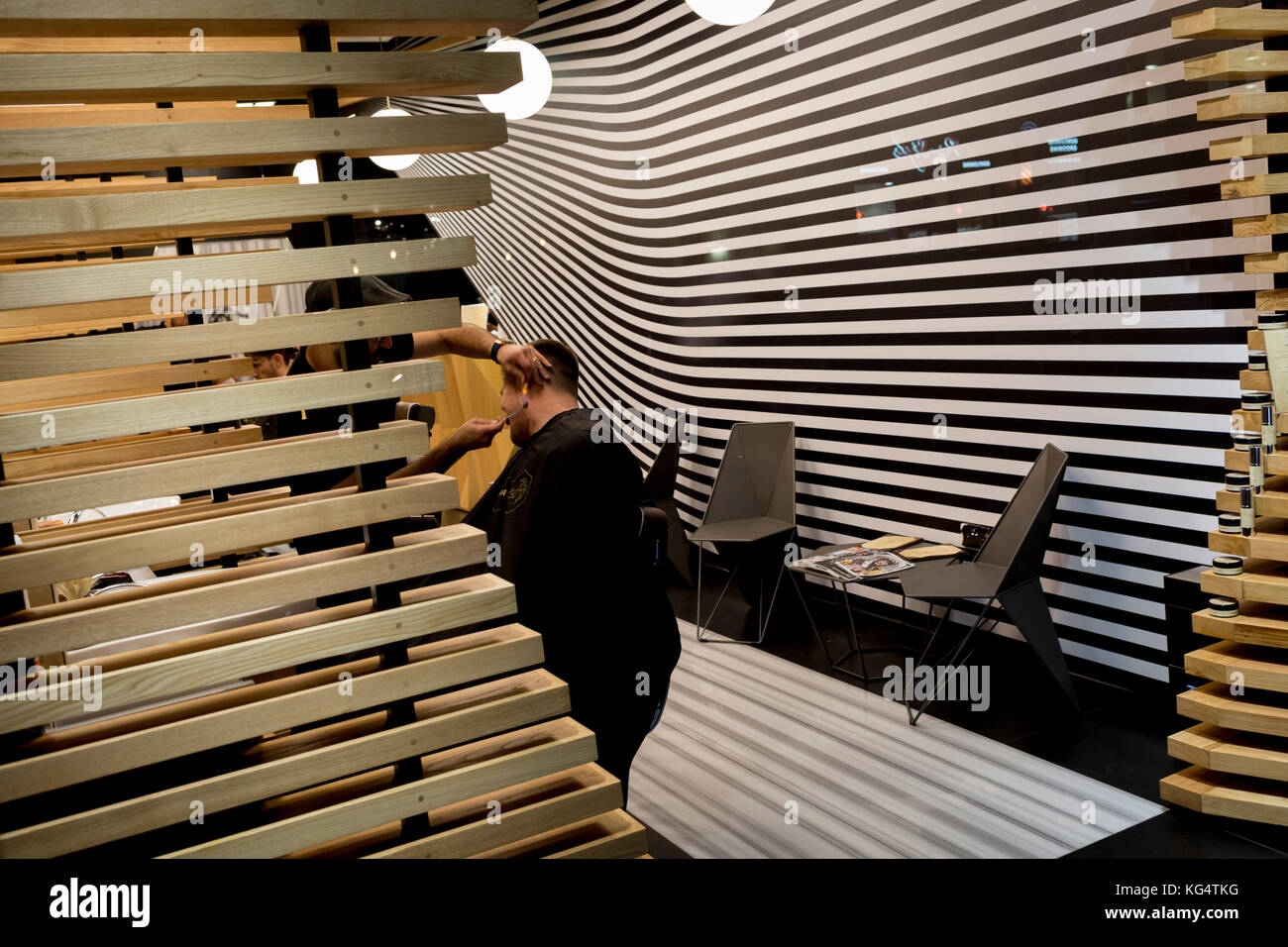 A City worker has a haircut and endures Turkish hair singeing in Adams ...