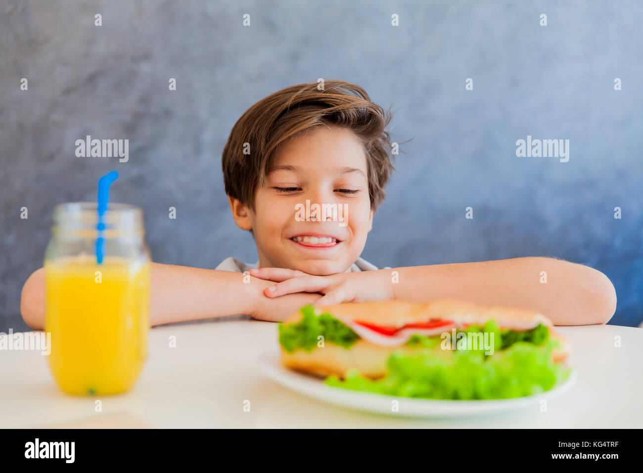Portrait of teen boy having breakfast Stock Photo - Alamy