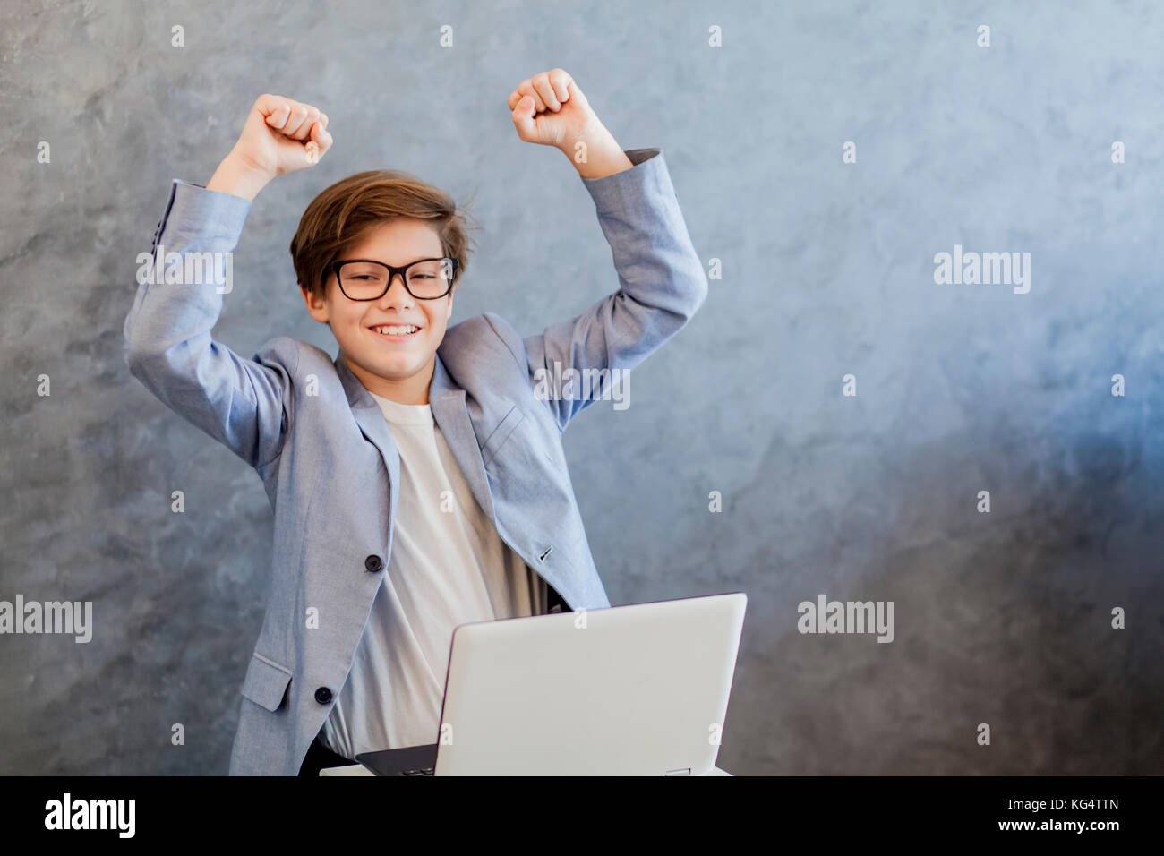 Portrait of teen boy using laptop Stock Photo - Alamy