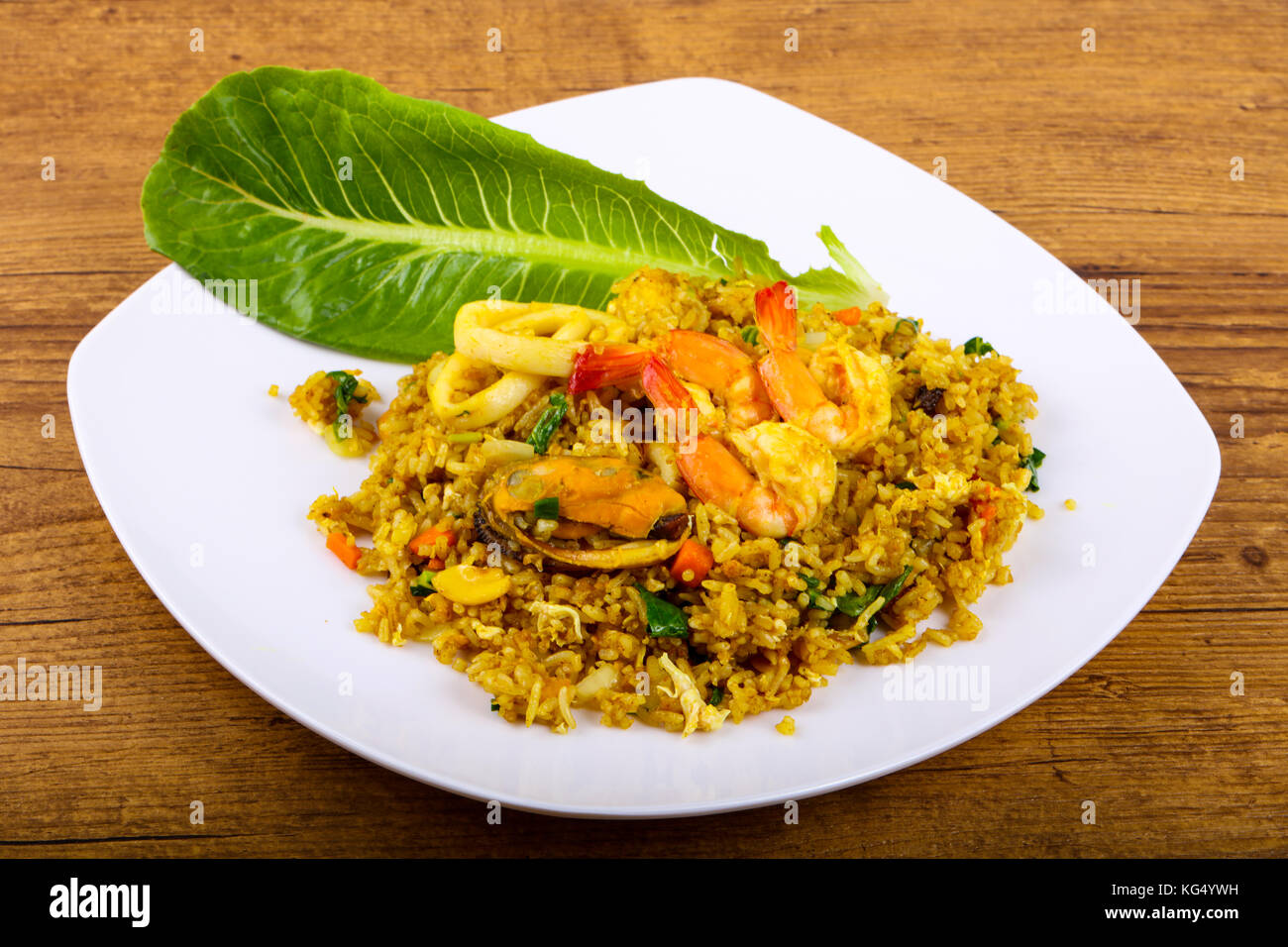 Fried rice with seafood - shrimp, mussel, squid Stock Photo - Alamy