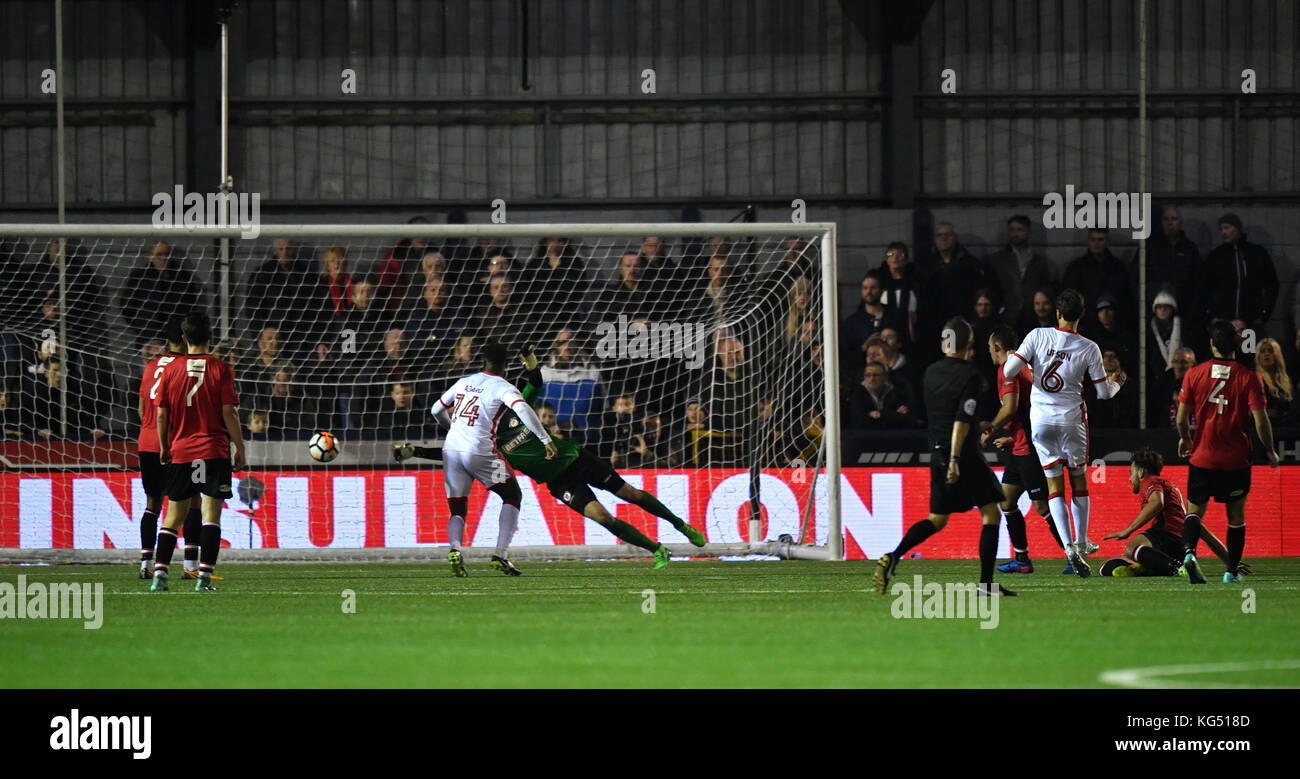 MK Dons' Edward Upson scores his side's fourth goal of the game during ...