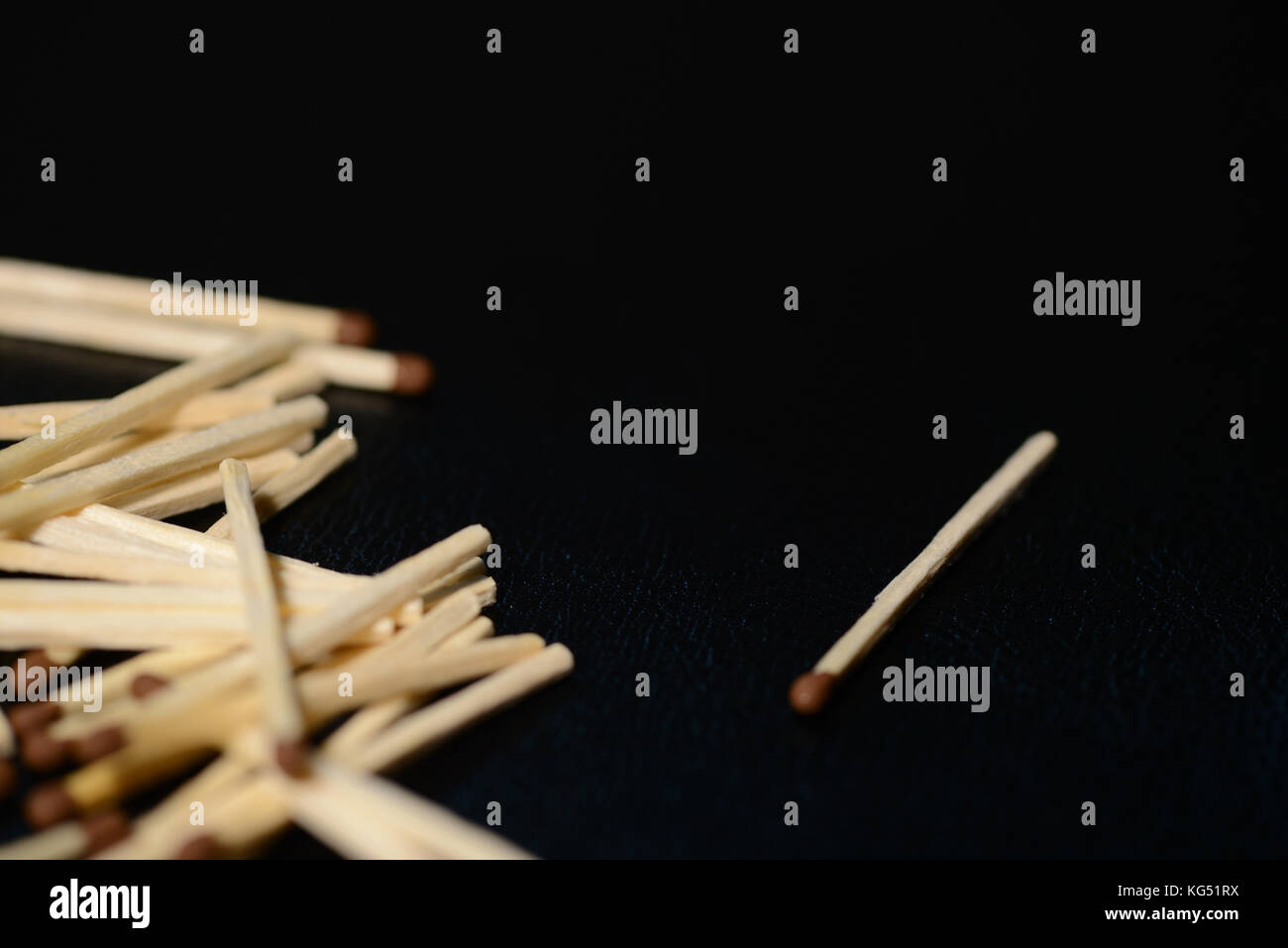 Scattered matches on dark background close up Stock Photo - Alamy