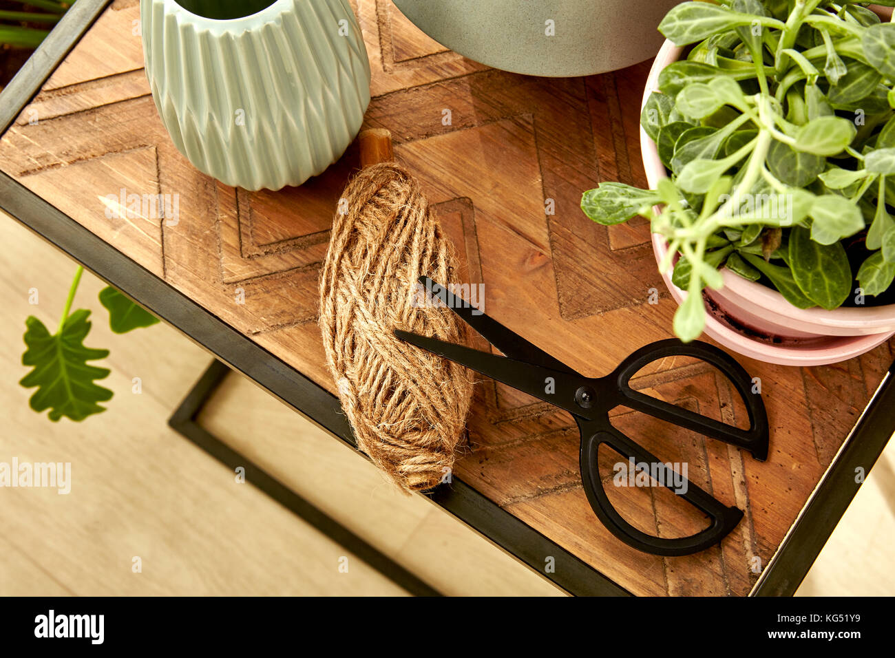 vivid interior scissors on wooden side table Stock Photo - Alamy