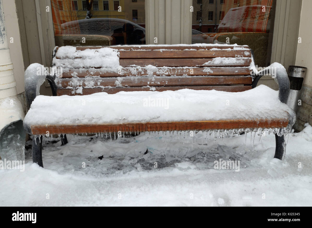 Bench on the street were covered in ice in winter Stock Photo - Alamy