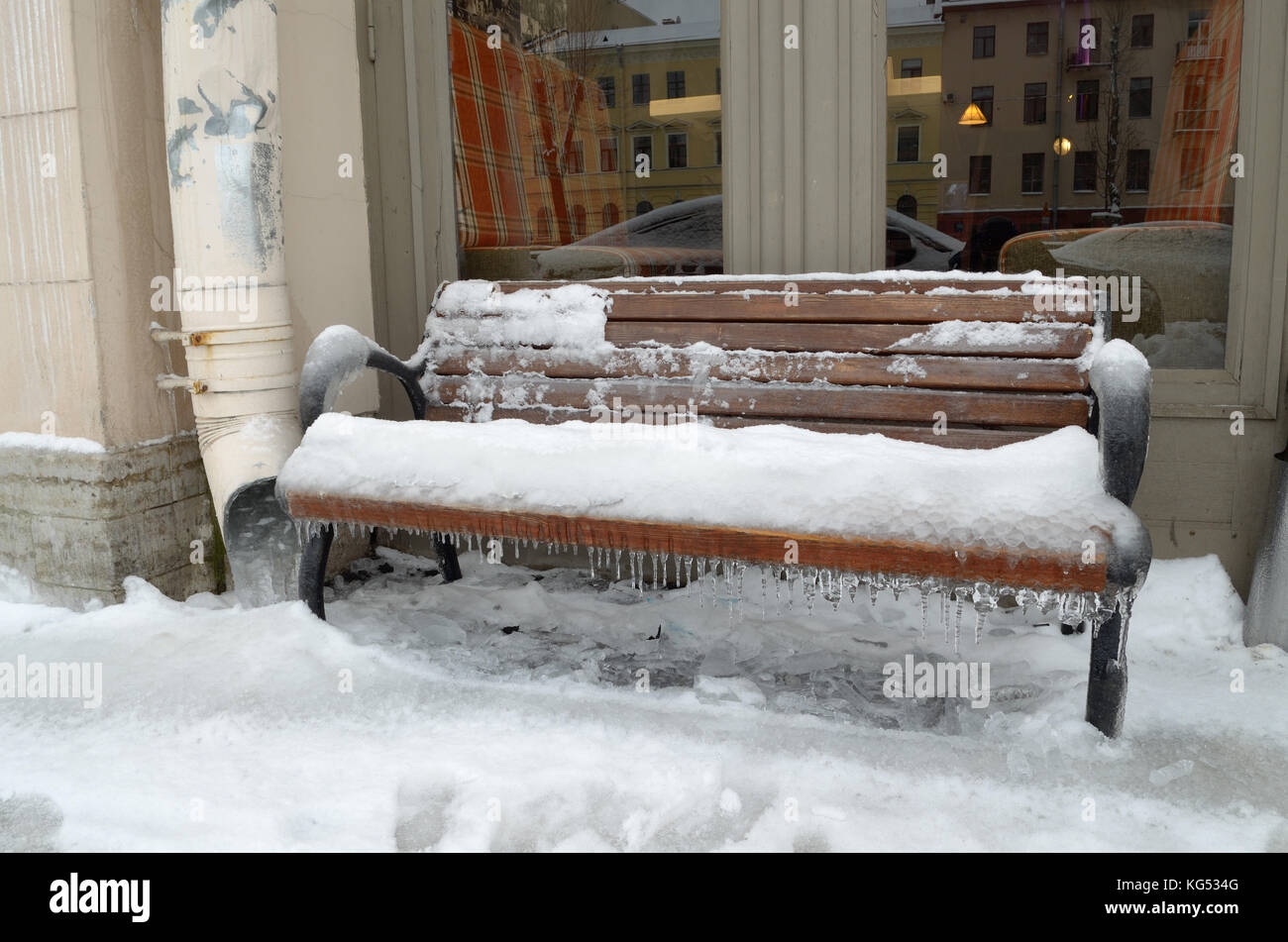 Bench on the street were covered in ice in winter Stock Photo - Alamy
