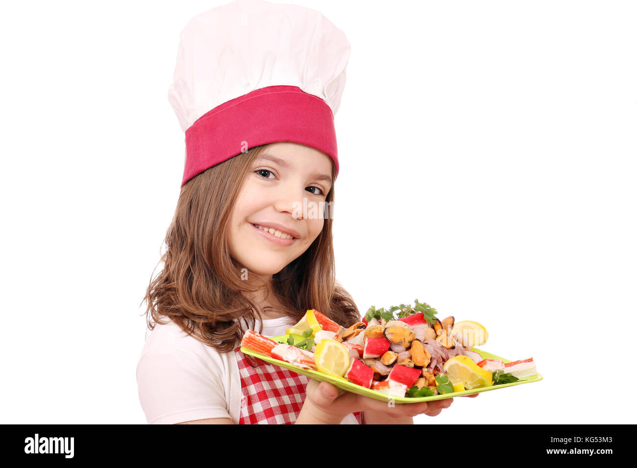happy little girl cook with seafood Stock Photo - Alamy
