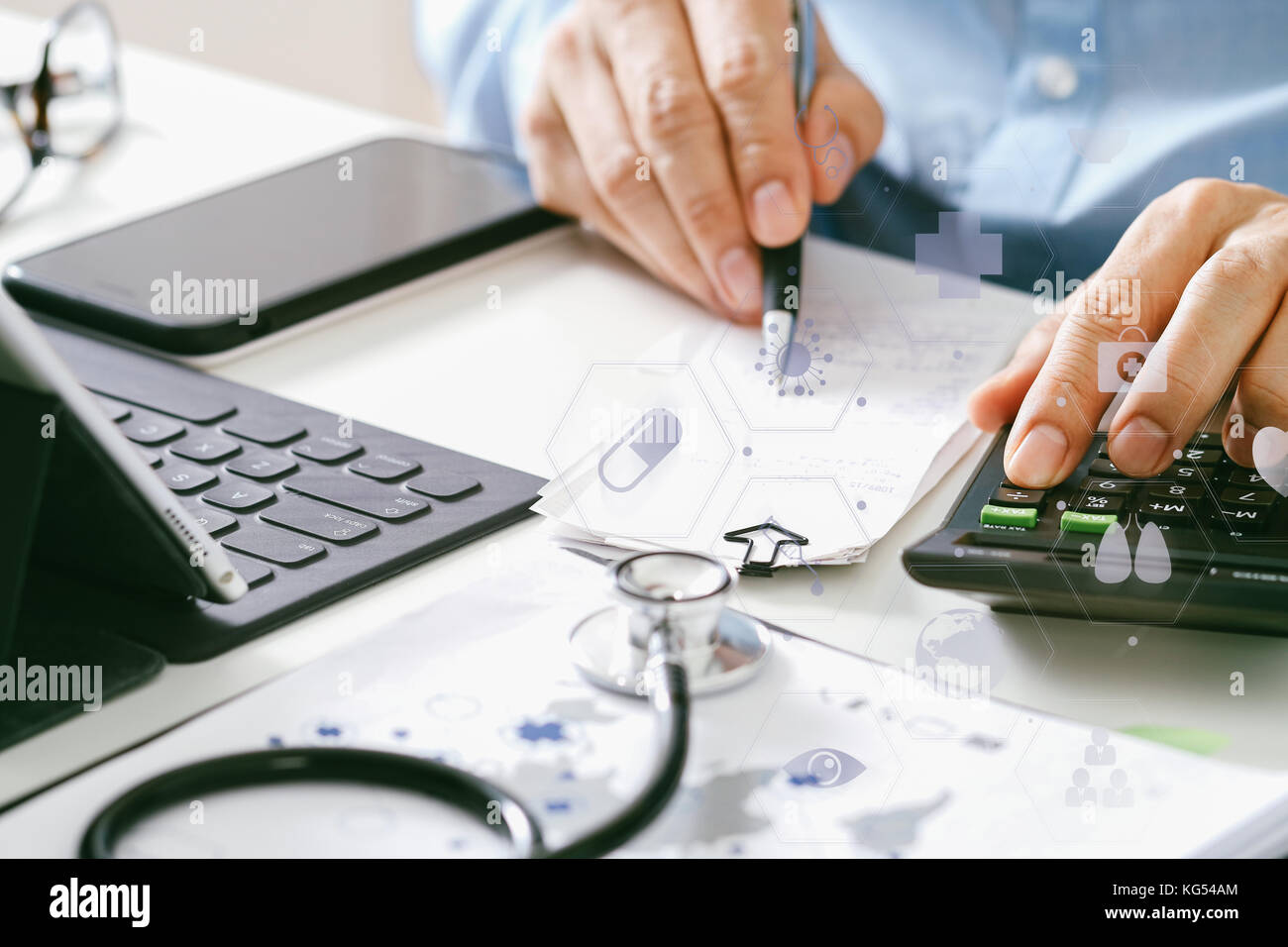 Healthcare costs and fees concept.Hand of smart doctor used a ...