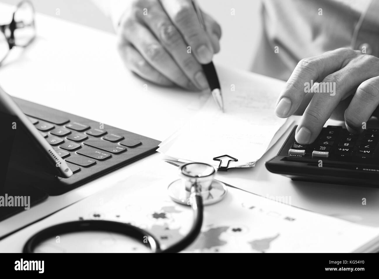 Healthcare costs and fees concept.Hand of smart doctor used a ...