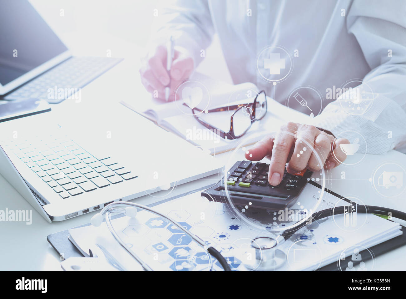 Healthcare costs and fees concept.Hand of smart doctor used a ...