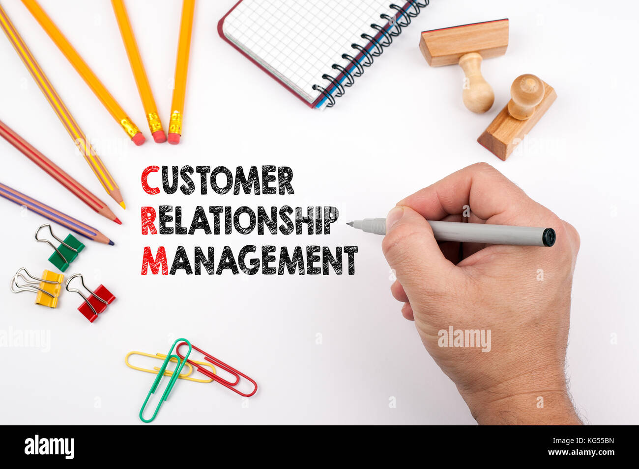 customer relationship management. White office desk on which various ...