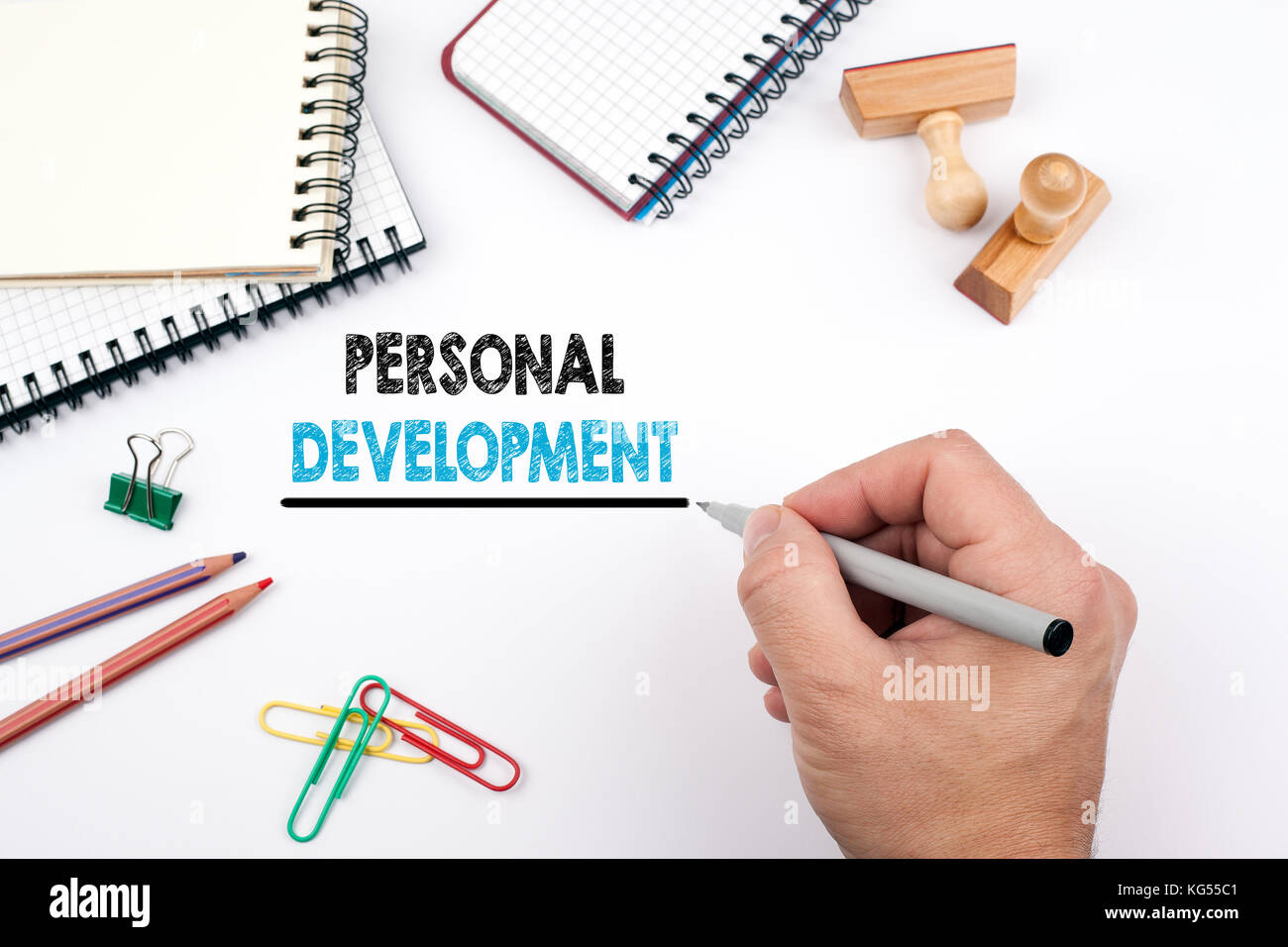 personal development. White office desk on which various items Stock ...