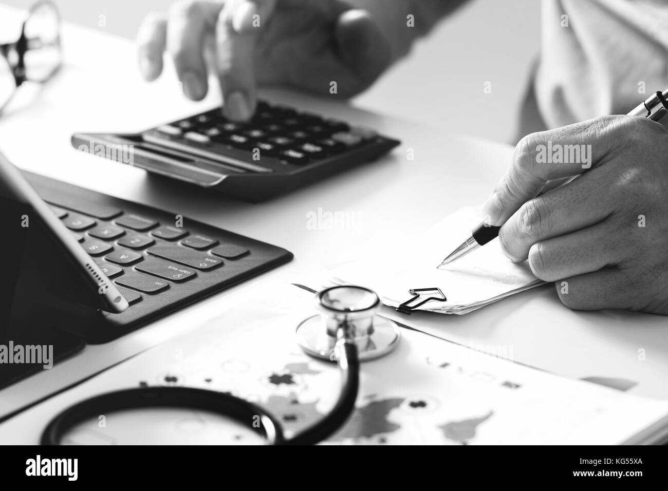 Healthcare costs and fees concept.Hand of smart doctor used a ...