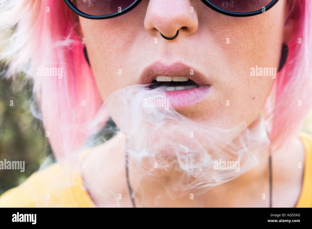 Face girl closeup, smoke from her mouth / Smoke out her mouth gently ...