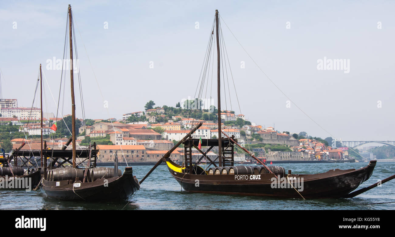 Traditional Rabelo boats with port barrels lie in the Douro river in ...