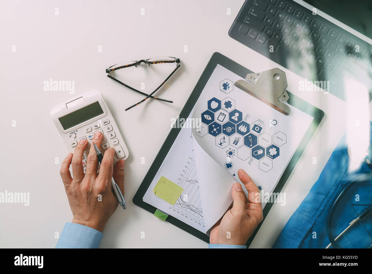 top view of Healthcare costs and fees concept.Hand of smart doctor used ...
