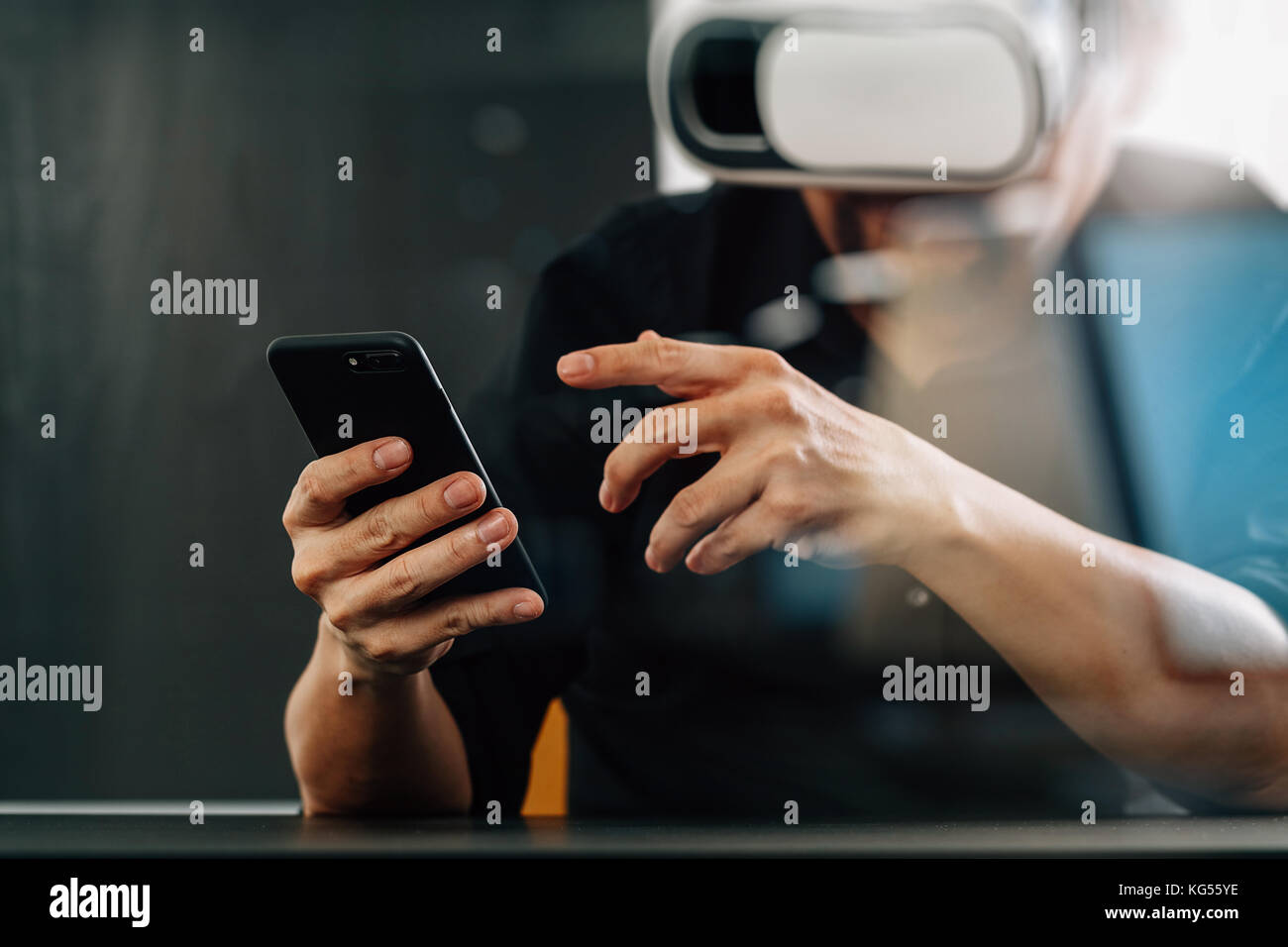businessman wearing virtual reality goggles in modern office with ...