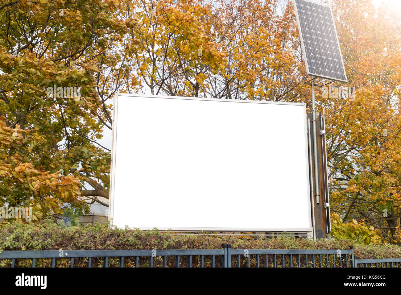 White Billboard mock up Ad Space behind solar panel Stock Photo - Alamy