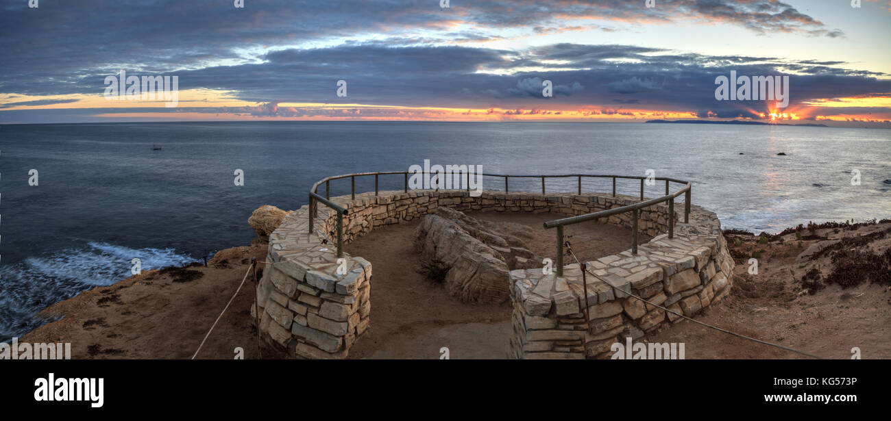 Sunset in a stone overlook that views Crystal Cove State Park Beach in ...