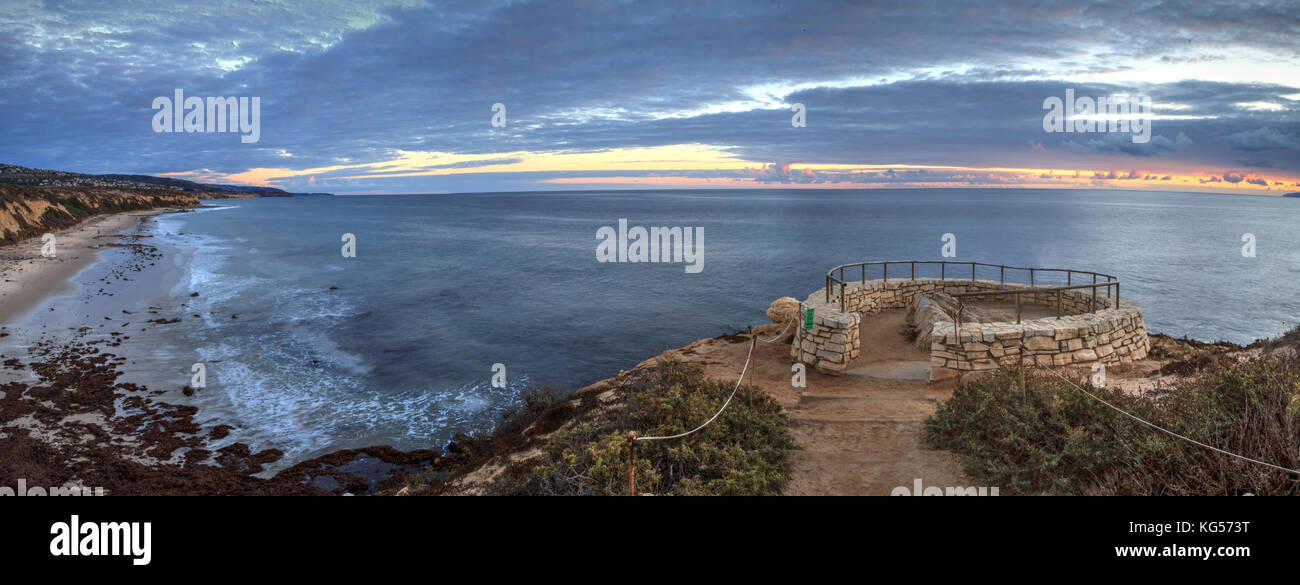 Sunset in a stone overlook that views Crystal Cove State Park Beach in ...