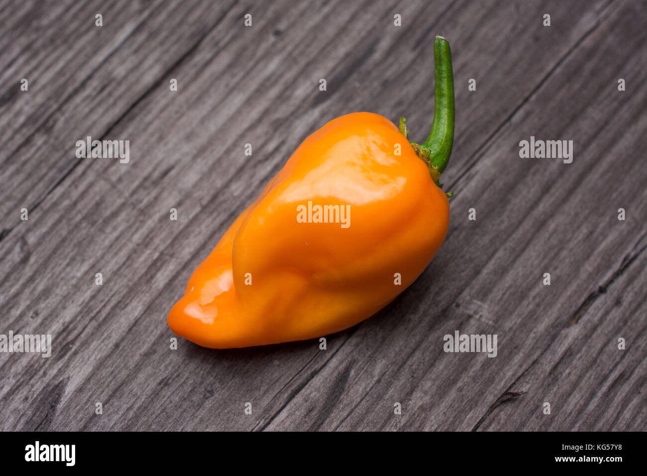 some vegetable of orange chili pepper habanero on wooden vintage ...