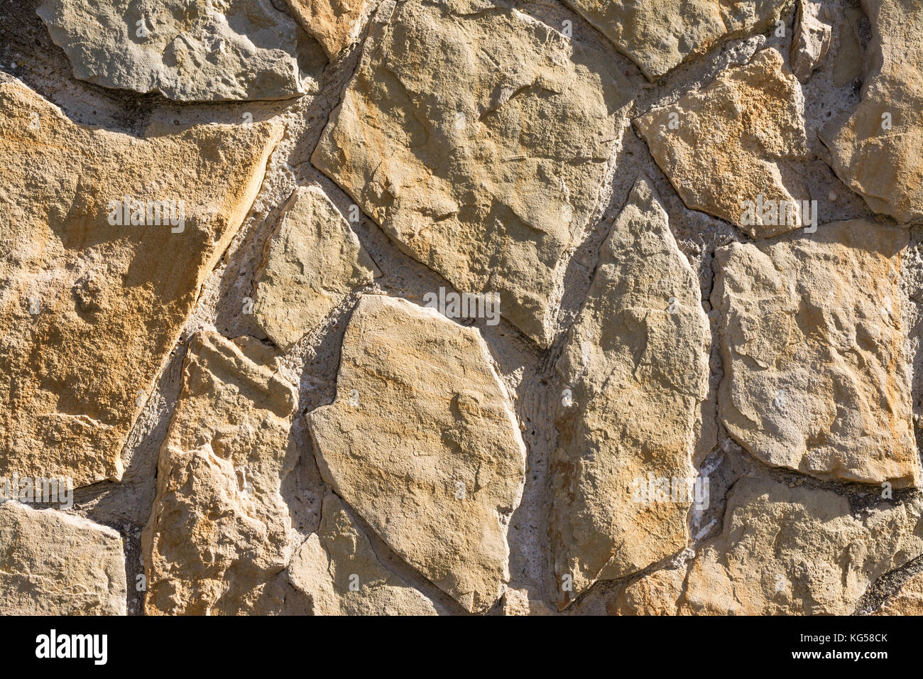 Pattern of chipped tuff stones wall texture and background Stock Photo ...