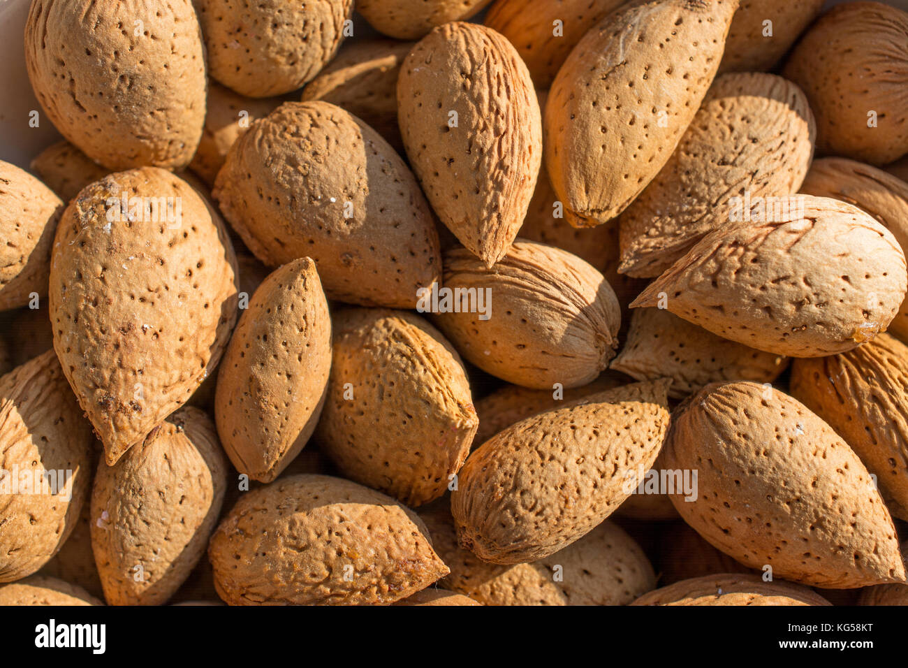 Group of raw almonds, with skin and rind,background. Main ingredient ...