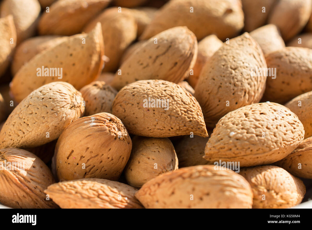 Group of raw almonds, with skin and rind,background. Main ingredient ...