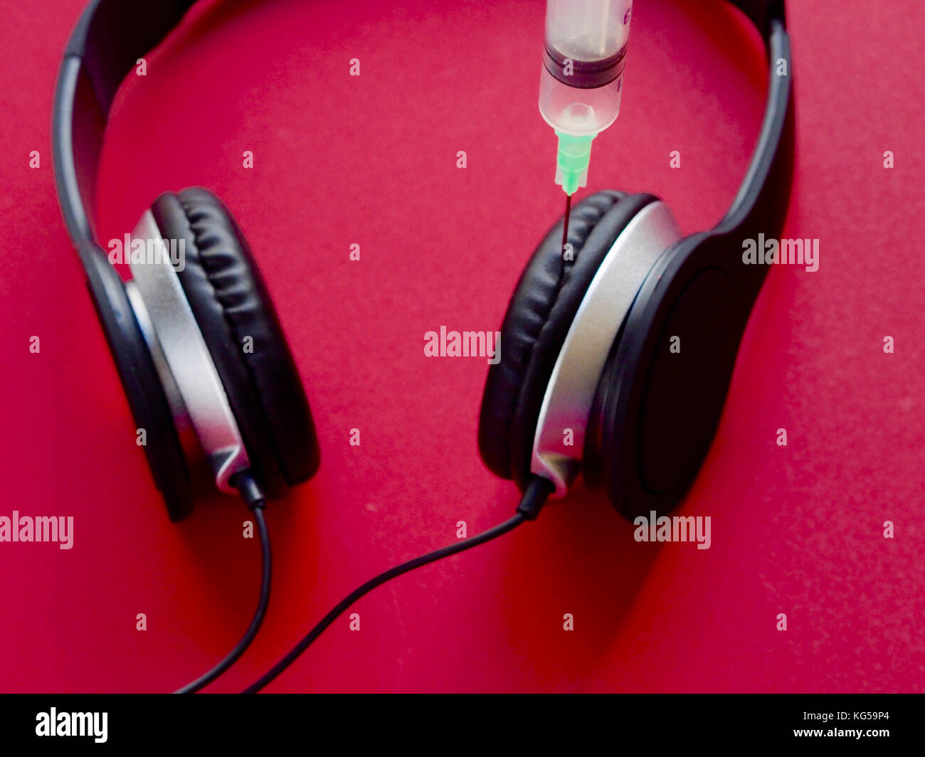 Headphone with syringe on red background - Addict to music concept ...
