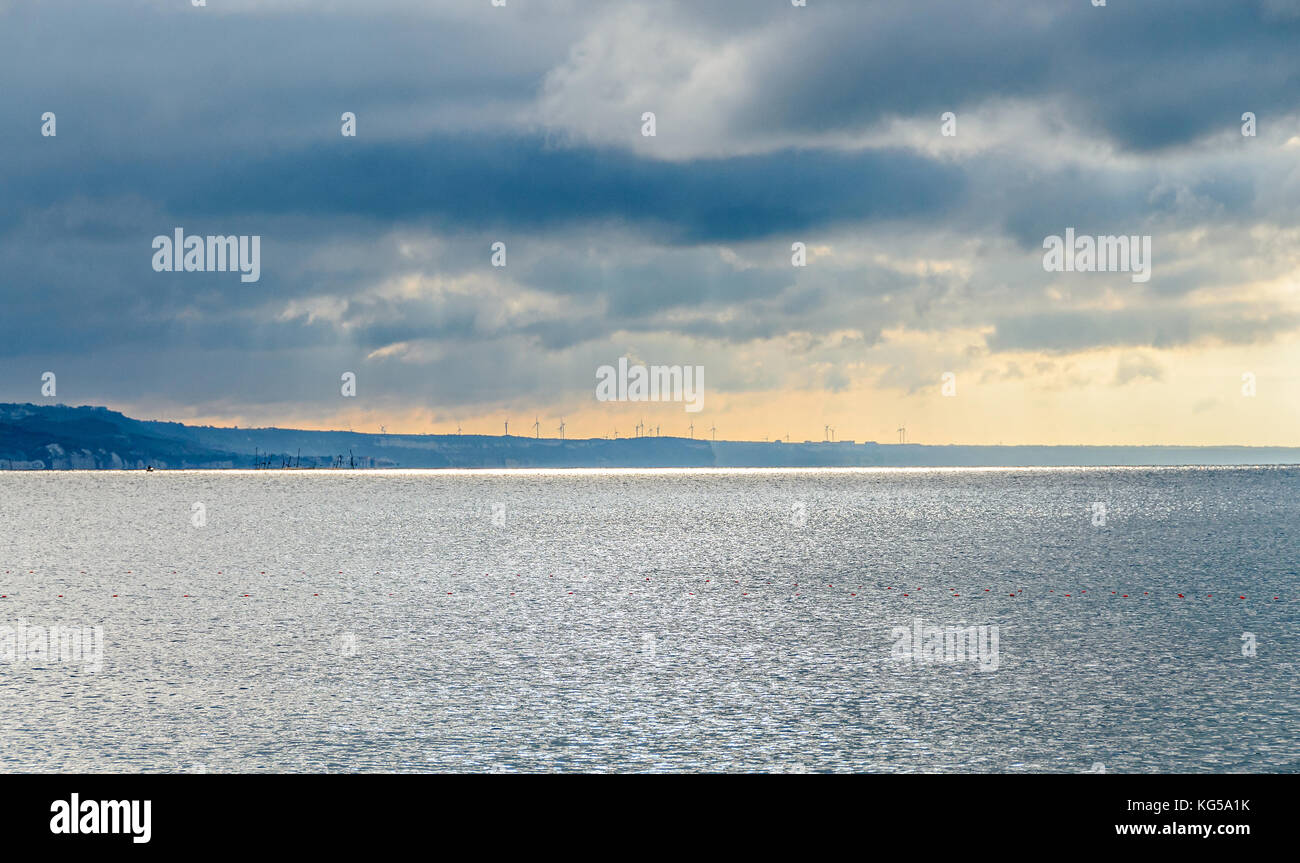 Eolian field and wind turbines farm, near Black Sea water, clouds blue ...