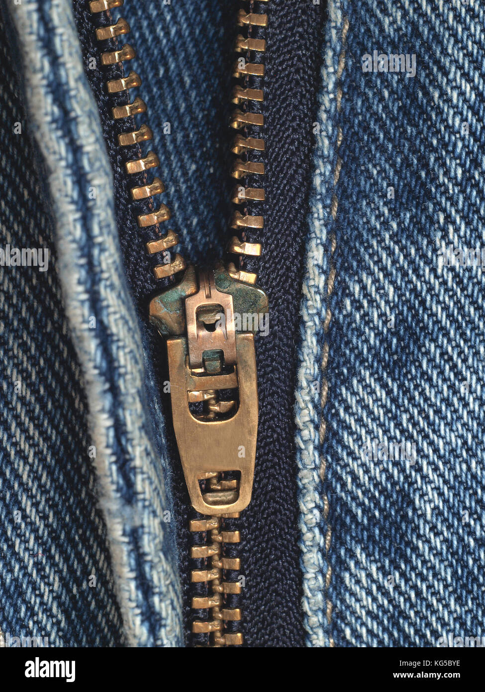 Jeans with golden color copper zipper close up Stock Photo - Alamy