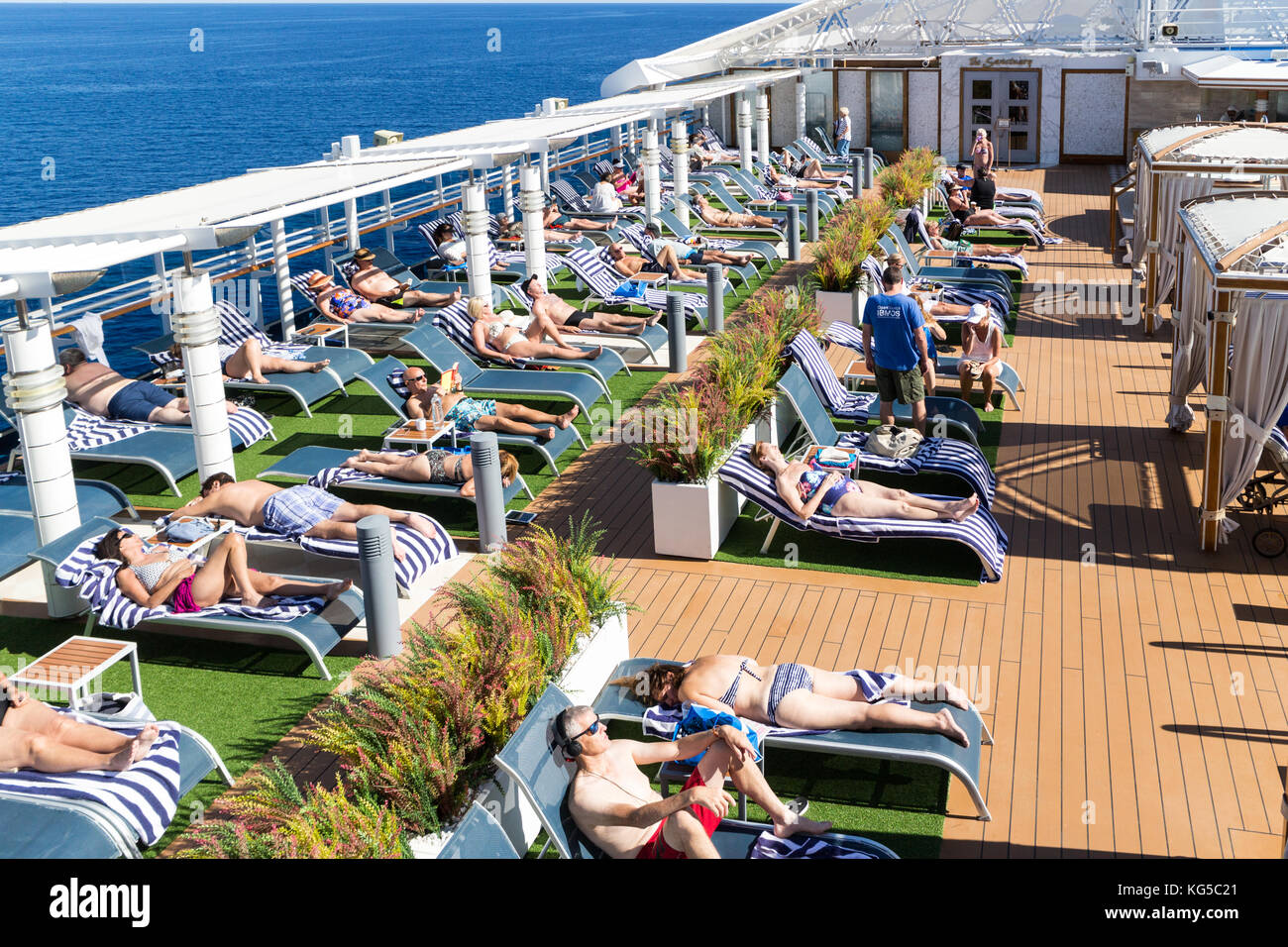 People sunbathing on the deck of the Royal Princess cruise, ship Stock ...