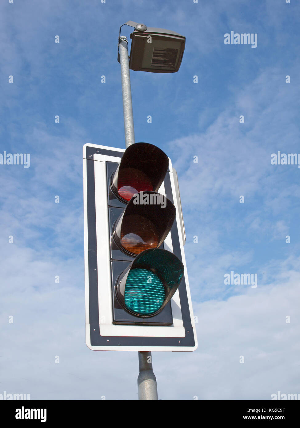 Traffic control lights with green signal on Stock Photo - Alamy