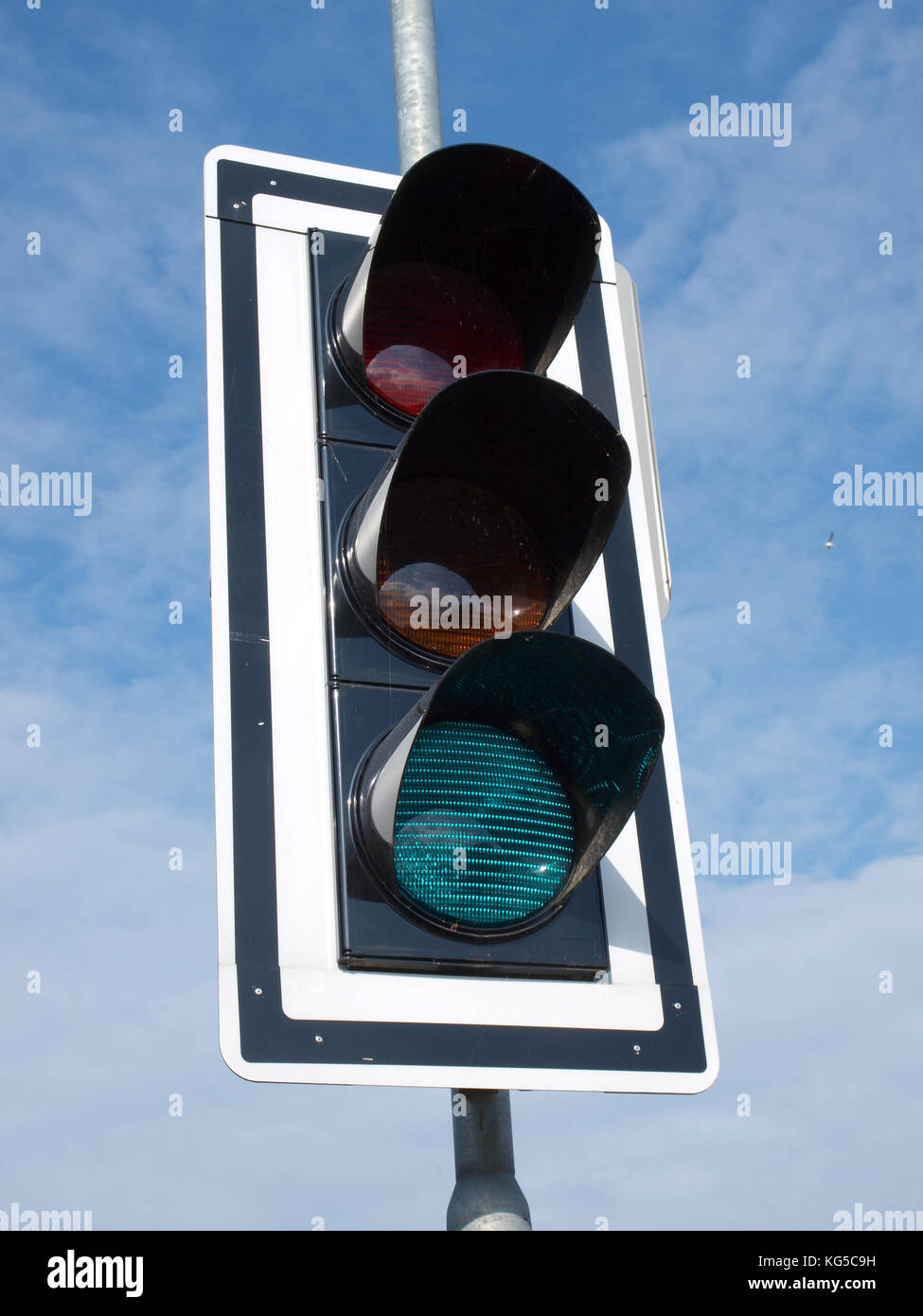 Traffic control lights with green signal on Stock Photo - Alamy