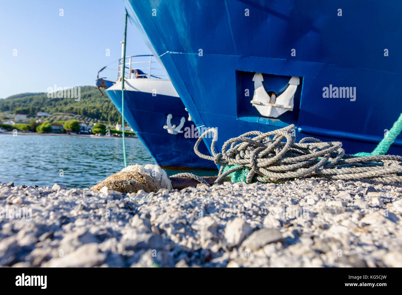 Docked two large fishing ships tied with rope to a moor at the local ...