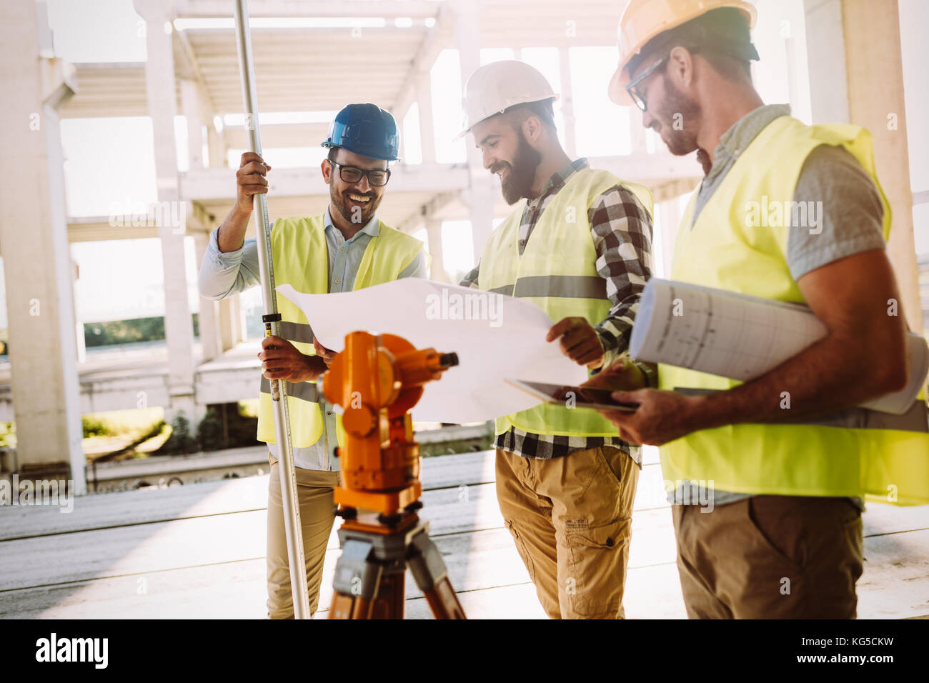 Portrait of construction engineers working on building site Stock Photo ...