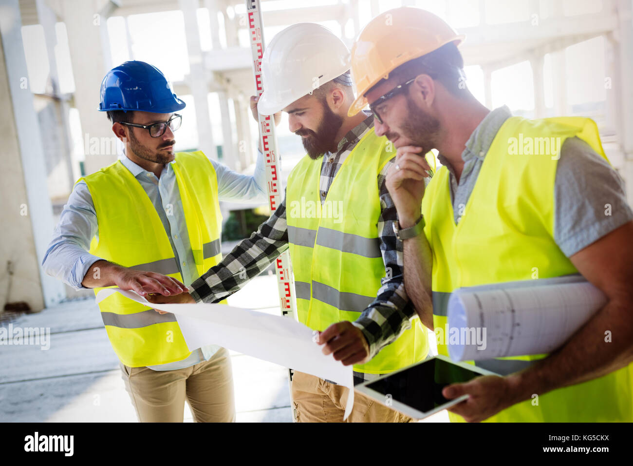 Portrait of construction engineers working on building site Stock Photo ...